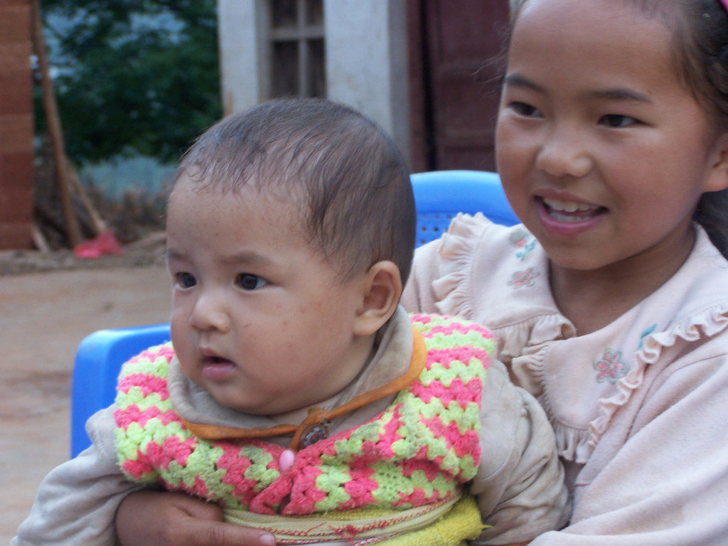 Chinese girl with baby brother - Asian Center for Pentecostal Theology